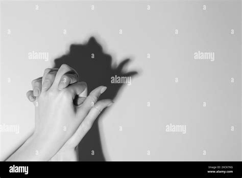 Woman Making Hand Gesture Like Bird On Light Background Closeup With