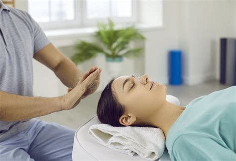 Young Woman Relaxing And Restoring Energy During Therapy Session With
