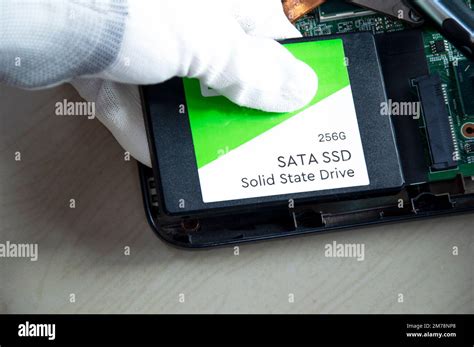 Technician Installing Ssd Drive In Old Computer Upgrading Computer Stock Photo Alamy