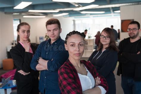 A Team Of Successful Programmers Sits In A Startup Office Strategizing New Business Projects