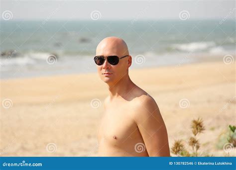 Bald Man With A Bare Bare Chest In Striped Swimming Trunks Or S Stock