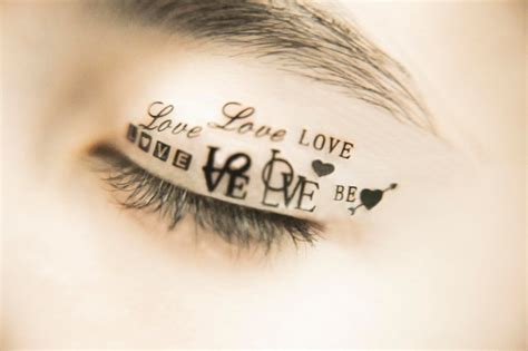 Premium Photo Close Up Of Love Text On Girl Eye