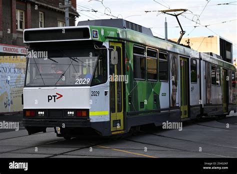 B Class Tram Featuring White And Green Livery With Ptv Logo On The