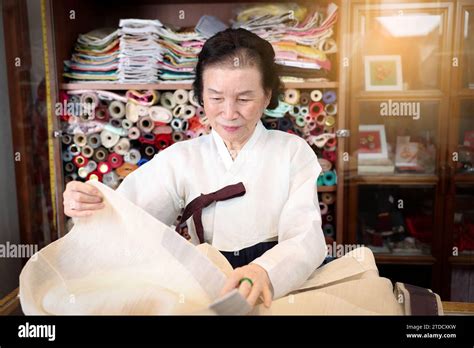 A Master Of Traditional Korean Clothing A Hanbok Expert Is Sewing For