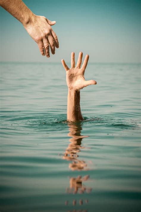 Hand Of Help For Drowning Man Life Saving In Sea Water Stock Image