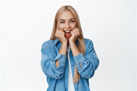 Cute And Silly Blond Girl Squeeze Her Cheeks And Smiling Looking