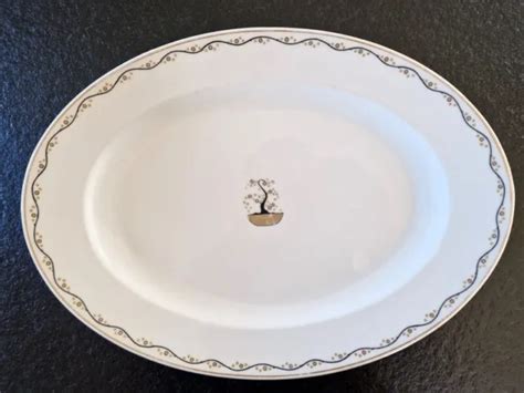 PLAT OVALE EN porcelaine de limoges Charles Ahrenfeldt illustré par