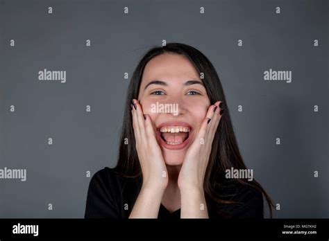 Beautiful Young Turkish Girl Standing Very Shocked And Rejoiced Stock