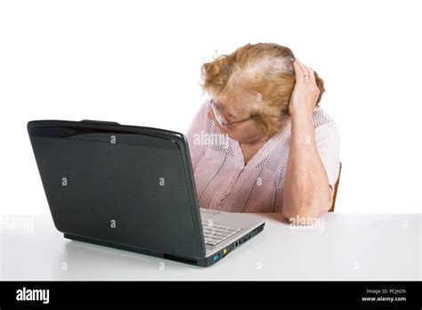 The Old Woman In Glasses Looks At The Screen Notebook On A White