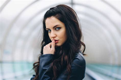 One Person Model Finger On Lips Leather Tunnel Headshot Long Hair
