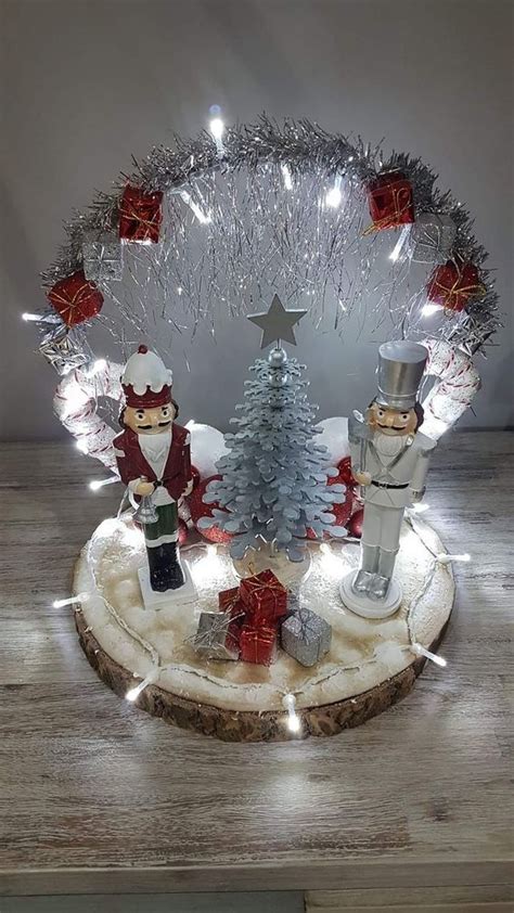 A Christmas Scene With Lights And Decorations On A Wooden Table In