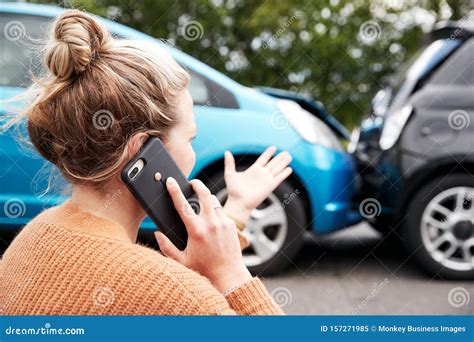Female Motorist Involved In Car Accident Calling Insurance Company Or