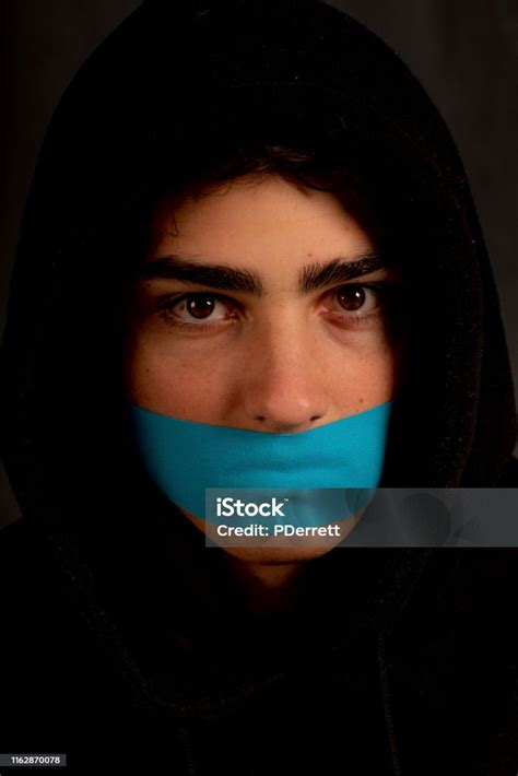 Young Man Expresses How He Feelssilenced By Using Tape Across His Mouth