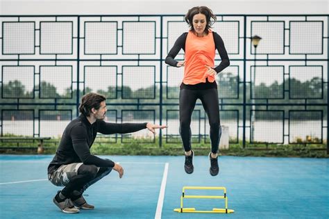 Premium Photo Jumping Training With Personal Fitness Trainer
