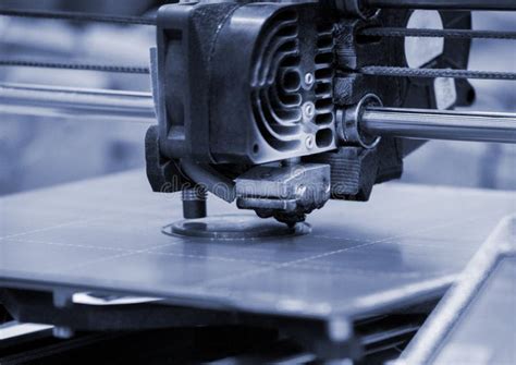 3d printer printing prototype from molten plastic process of creating