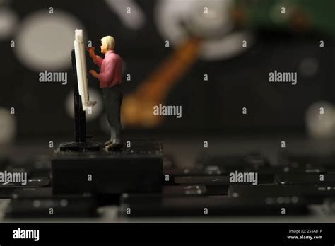 Big Data Concept Miniature Engineer Working With Drafting Table With Open Hard Disk Background