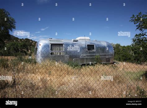 A Classic Airstream Trailer Parked In A Yard In Placitas Sandoval