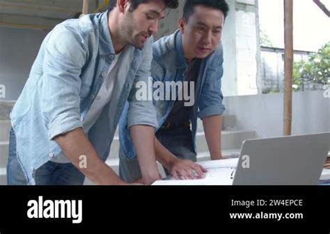 Civil Engineers Inspector And Asian Architect Discussing Meeting