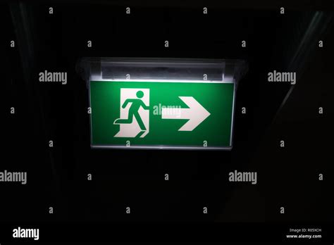 Emergency Exit Sign In Dark Parking Garage Stock Photo Alamy