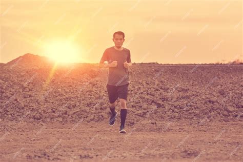 Premium Photo Full Length Of Young Man Running On Field