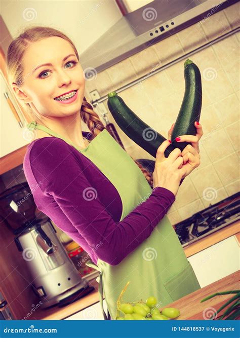 Woman In Kitchen Holds Zucchini Vegetable Stock Image Image Of