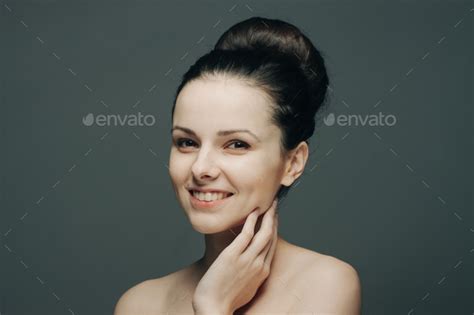 Pretty Woman Naked Shoulders And Clear Skin Charm Dark Background Stock