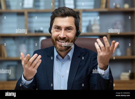 First Person View Of Handsome Man In Formalwear And Headset Smiling
