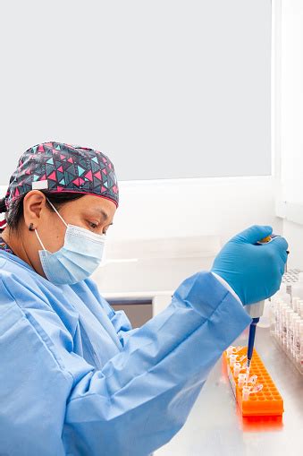 Female Scientist Extracting Dna Using The Spin Columnbased Nucleic Acid
