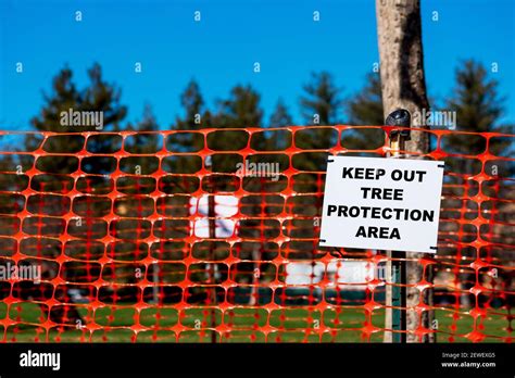 Keep Out Tree Protection Area Sign On Orange Tree Protection Plastic Mesh Fencing Stock Photo