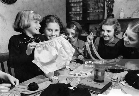 Young Girls Showing Off One Of Six Pairs Of Knickers That They Made