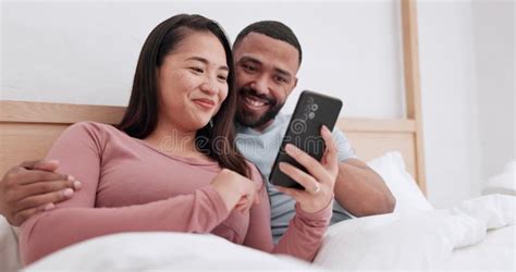 Bedroom Cellphone And Happy Couple Laugh Relax And Reading Funny