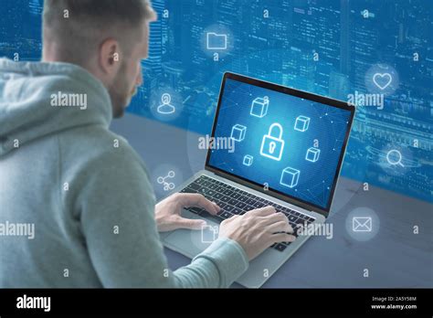 Concept Of Online Security Guy Work On Computer With Conceptual Icons