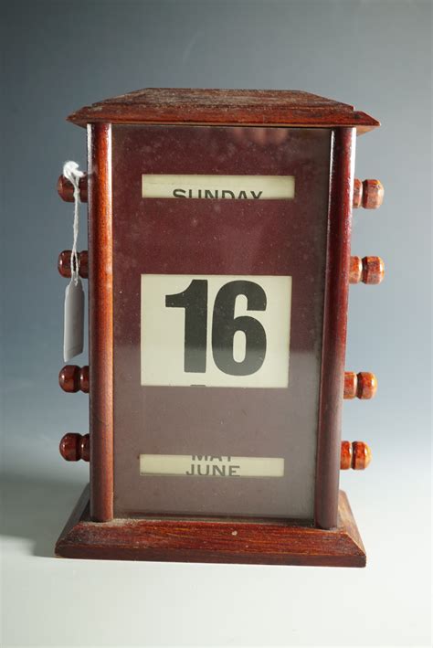 A Vintage Mahogany Desk Calendar