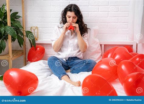Girl Is Blowing Air Balloon At Home Handsome Brunette Girl Inflating