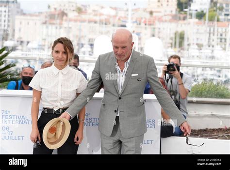Lea Mysius Left And Director Jacques Audiard Pose For Photographers