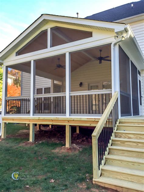 A Screened Porch With Stairs Leading Up To The Front Door And Second