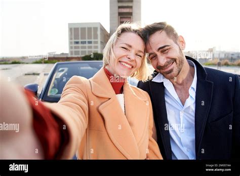 Cheerful Middle Aged Marriage Taking Selfie Looking At Camera Smiling