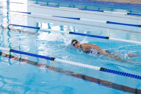 Caucasian Female Athlete Swimmer Swimming Laps In A Pool Stock Image