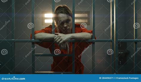 Female Prisoner In Orange Uniform In Jail Cell Stock Image Image Of