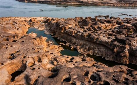 Premium Photo Landscape Of Rock Or Sandstones And Water For Background At Sam Phan Bok