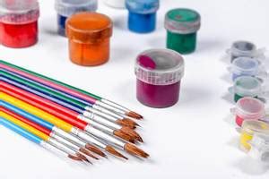 Colourful Painter S Palette With Oil Paint And Brushes On White