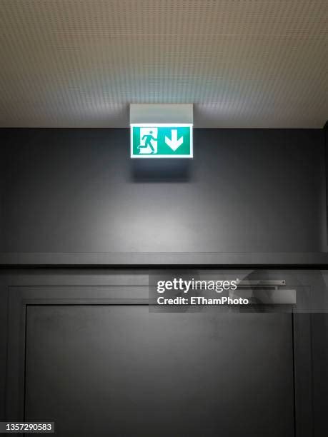Exit Sign Hanging From Ceiling Photos And Premium High Res Pictures