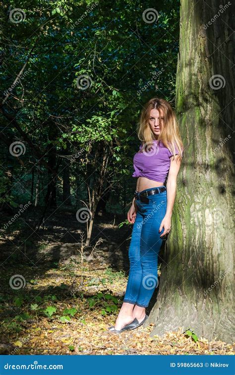 Young Beautiful Girl Blond Model With Long Blond Hair In Jeans And