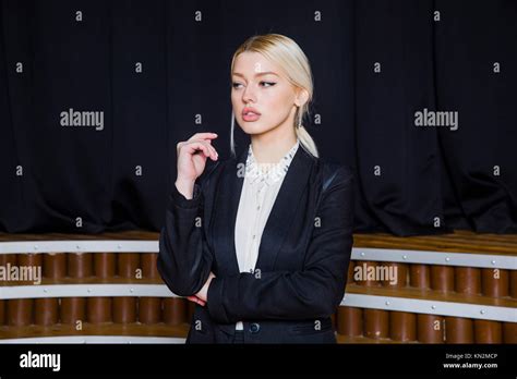 Beautiful Blonde Businesswoman With Puffy Lips At Loft Office In Suit