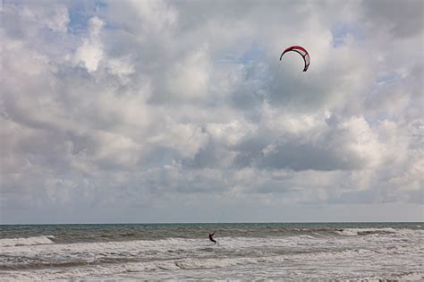 Professional Kiter Makes The Difficult Trick On A Beautiful Background