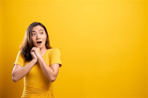 Premium Photo Shock Woman Against Yellow Background