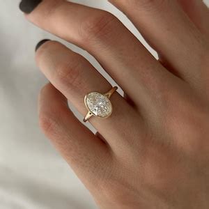2 Carat Oval Lab Grown Diamond Solitaire Ring Bezel Set Diamond