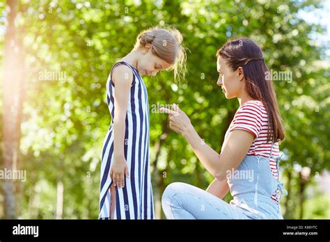 Strict Mother Talking To Her Naughty Babe In Park Stock Photo Alamy