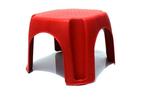 Premium Photo Red Stool Against White Background