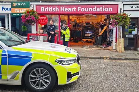 Three Seriously Injured After Car Reverses Through Chichester Charity